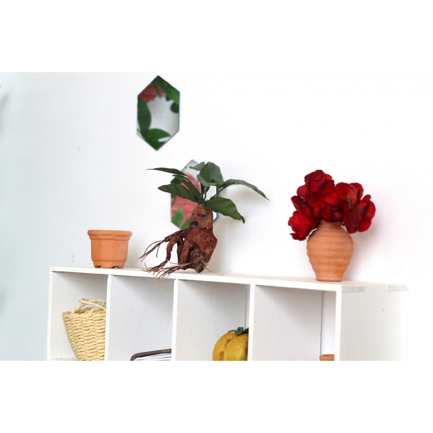 Miniature mandragora root plant in the pot, dollhouse figurine scream