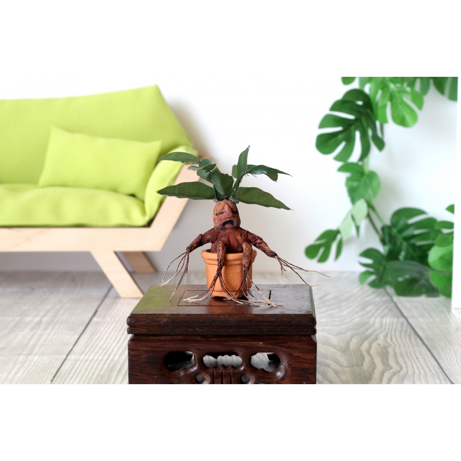 Miniature mandragora root plant in the pot, dollhouse figurine scream